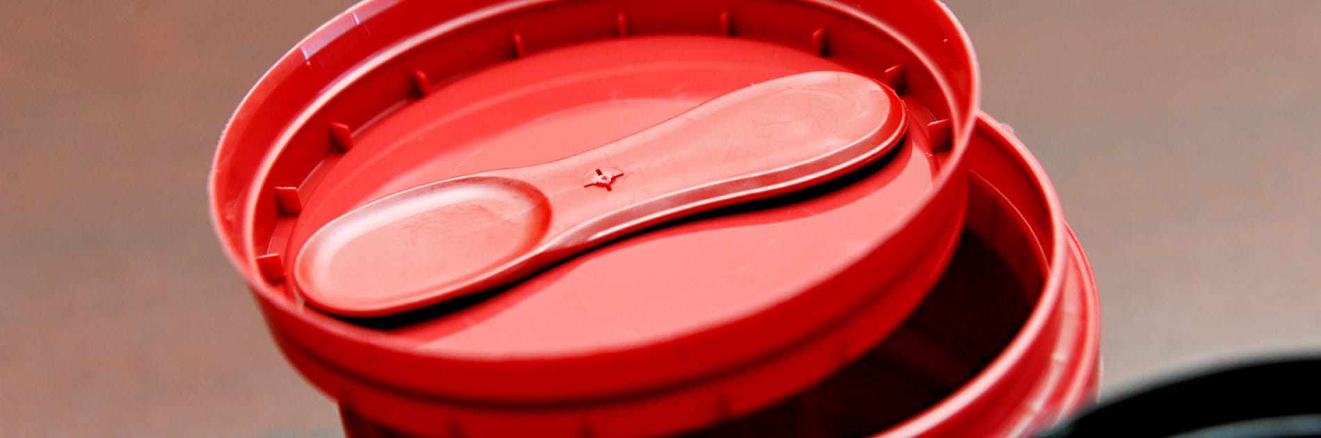 Spoon in lid: Ingenuity and collaboration at work. - Fourmark Manufacturing